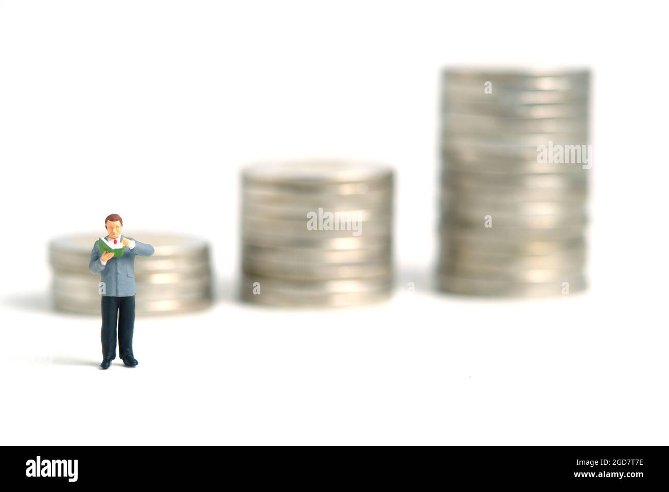 Miniature people toy figure photography. A men student standing in ...