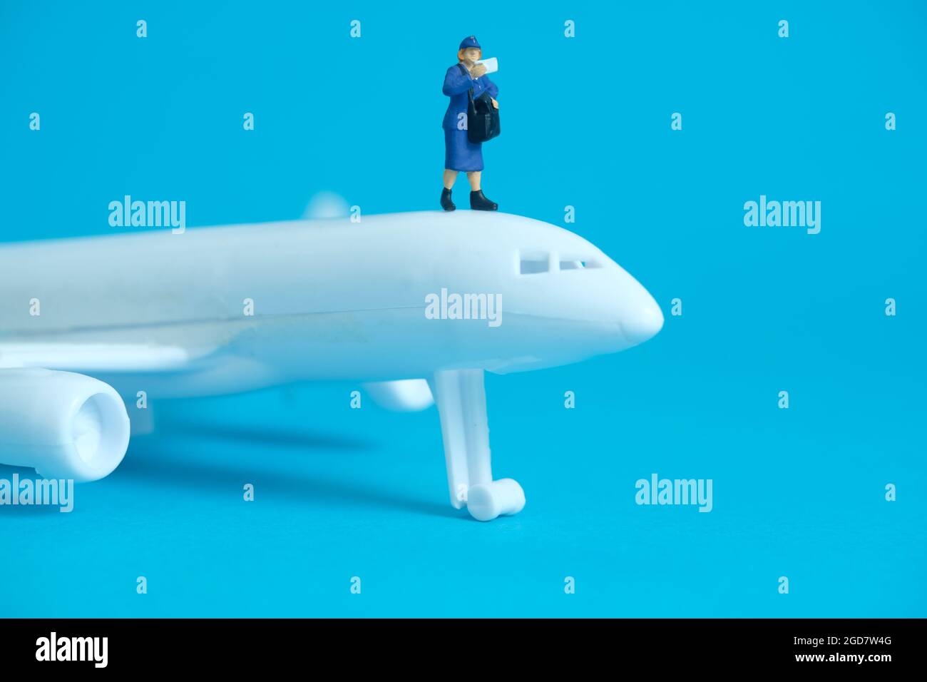 Miniature people toys conceptual photography. Airplane parcel package ...