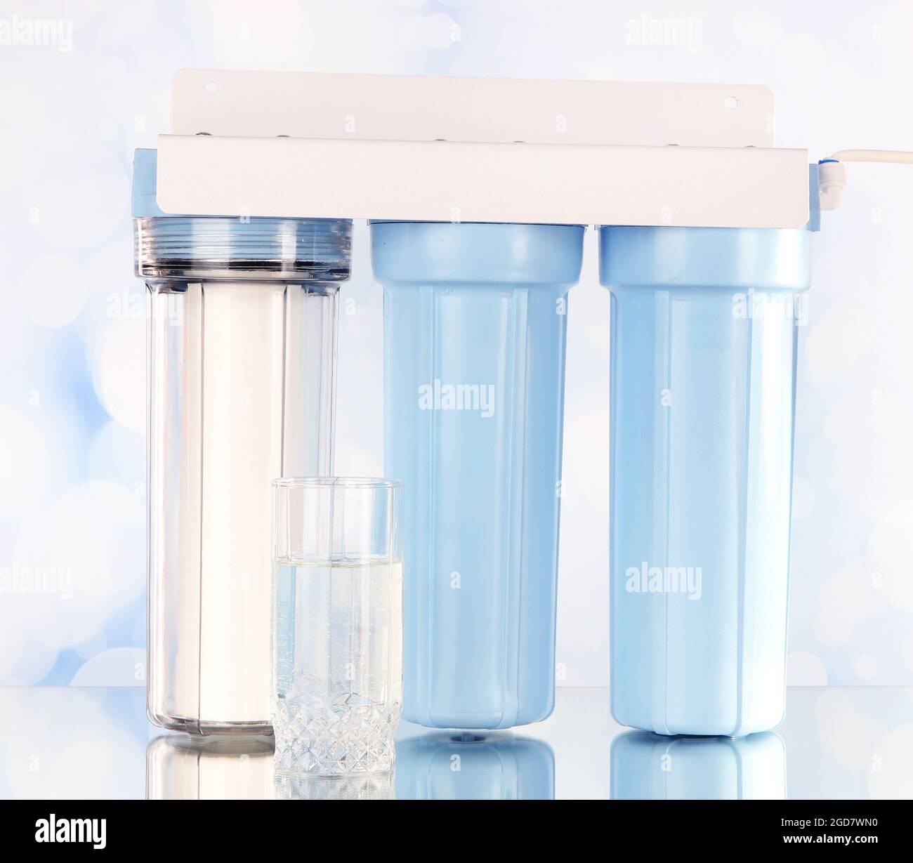 Filter system for water treatment with glass on bright background Stock ...