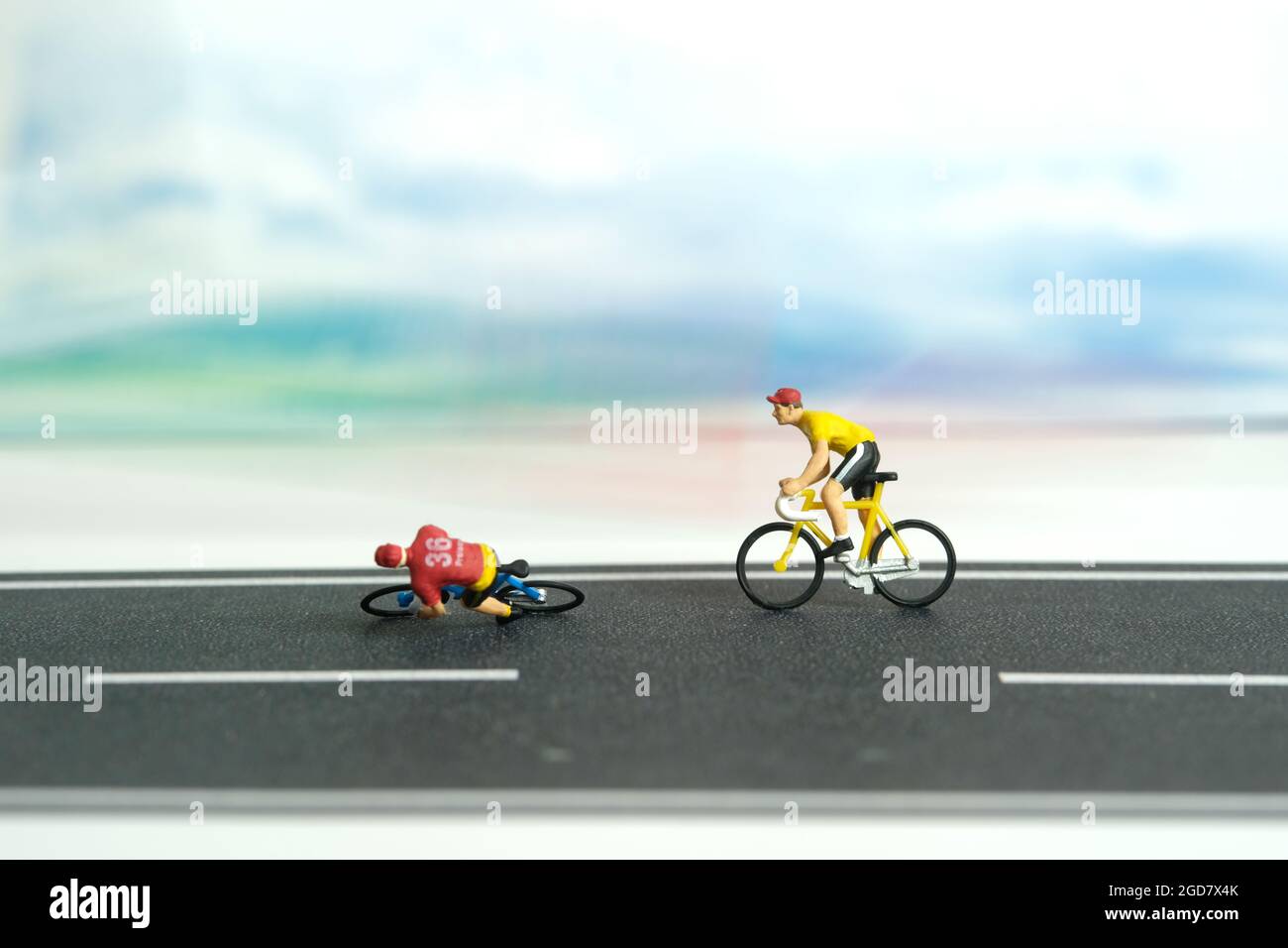 Miniature people toy figure photography. Fast movement motion bicycle ...