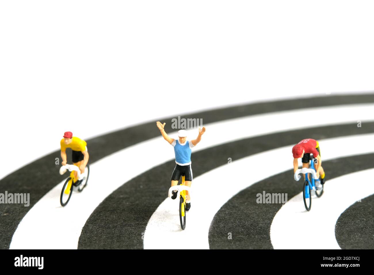 Miniature people toy figure photography. Bike cycling track. A biker ...