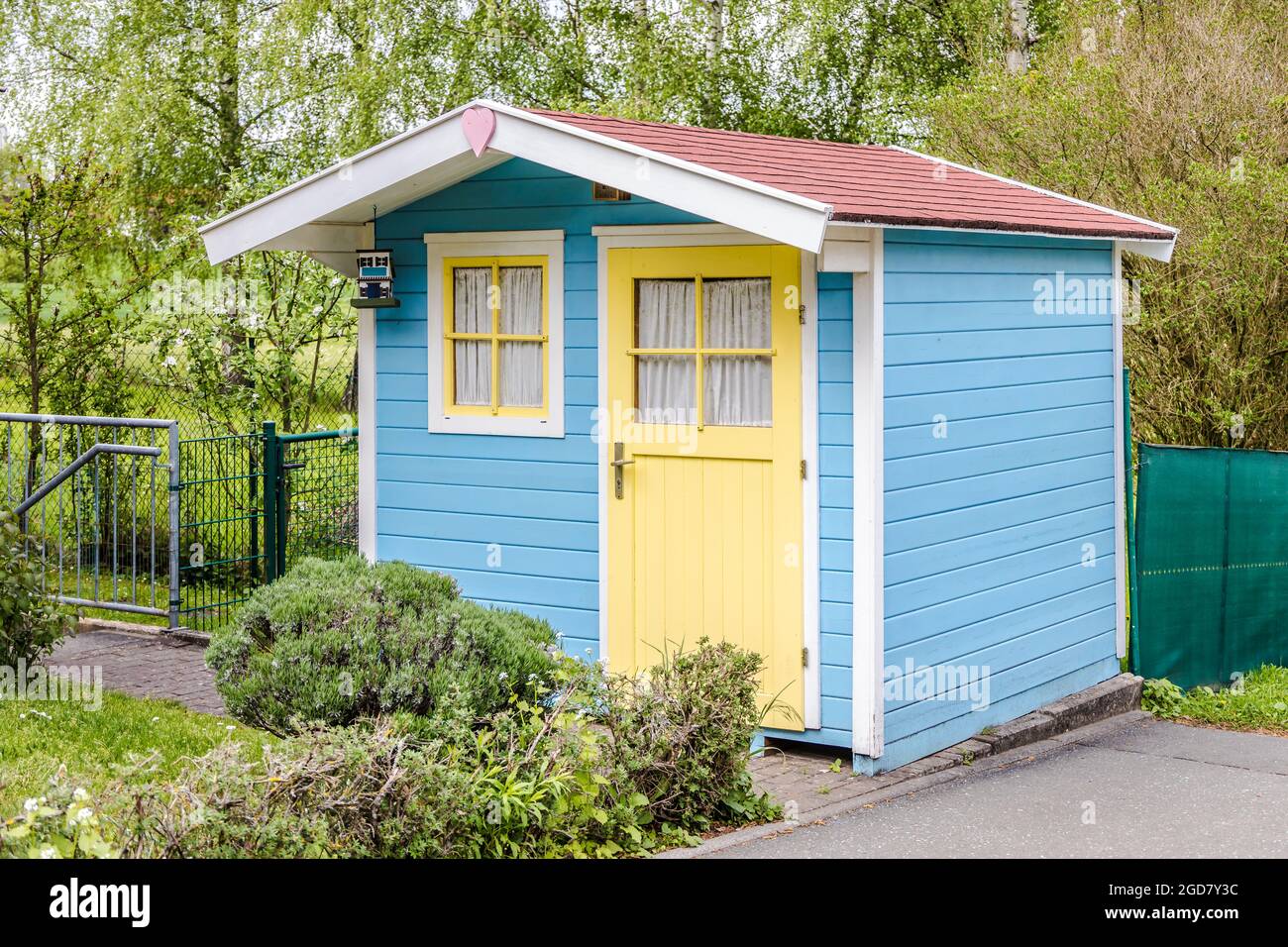 Small Garden Shed or Tool Shed with yellow Door Stock Photo - Alamy