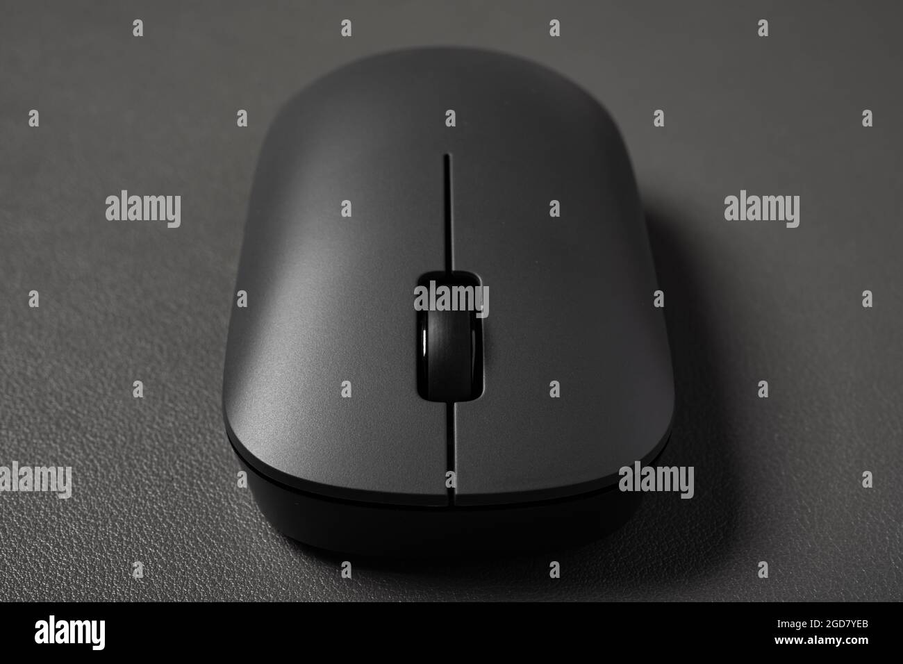 front view black wireless mouse on a dark background Stock Photo - Alamy