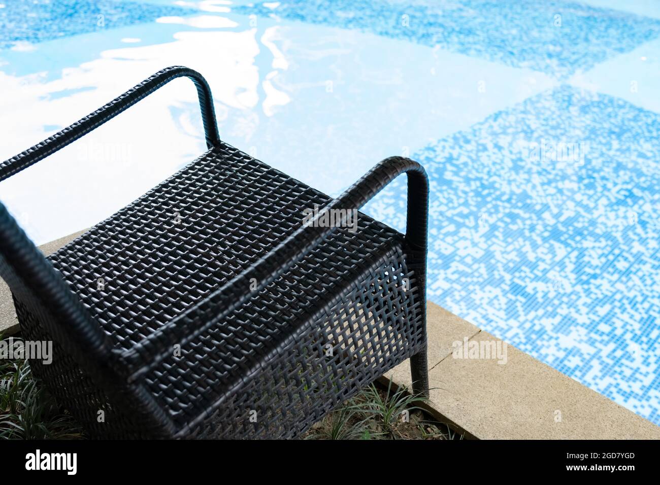 seat on the edge of a swimming pool Stock Photo - Alamy
