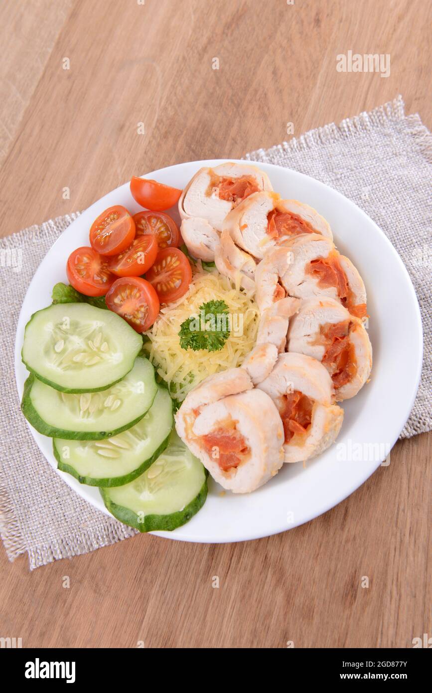 Delicious chicken roll on plate on table close-up Stock Photo - Alamy