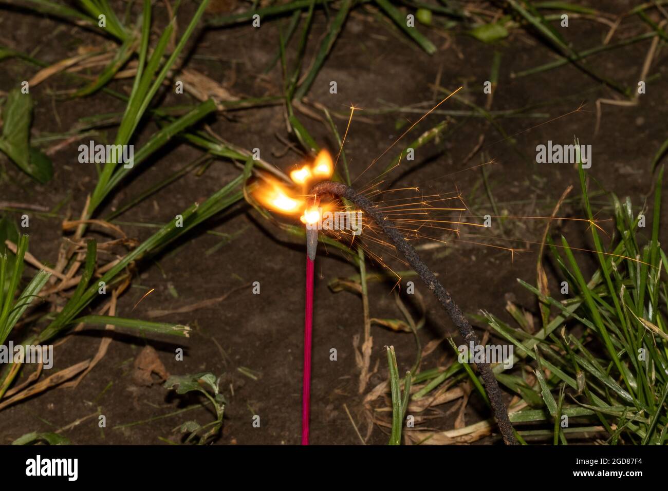 Fourth of July sparkler with ground back ground . High quality photo ...