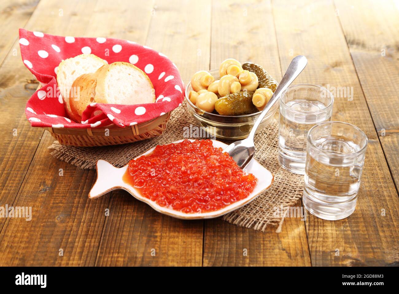 Composition with glass of vodka and marinated mushrooms, cucumbers on ...