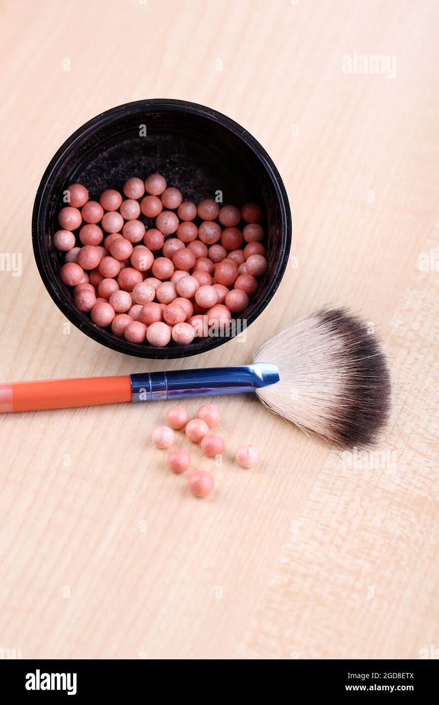 Powder balls on wooden background Stock Photo - Alamy
