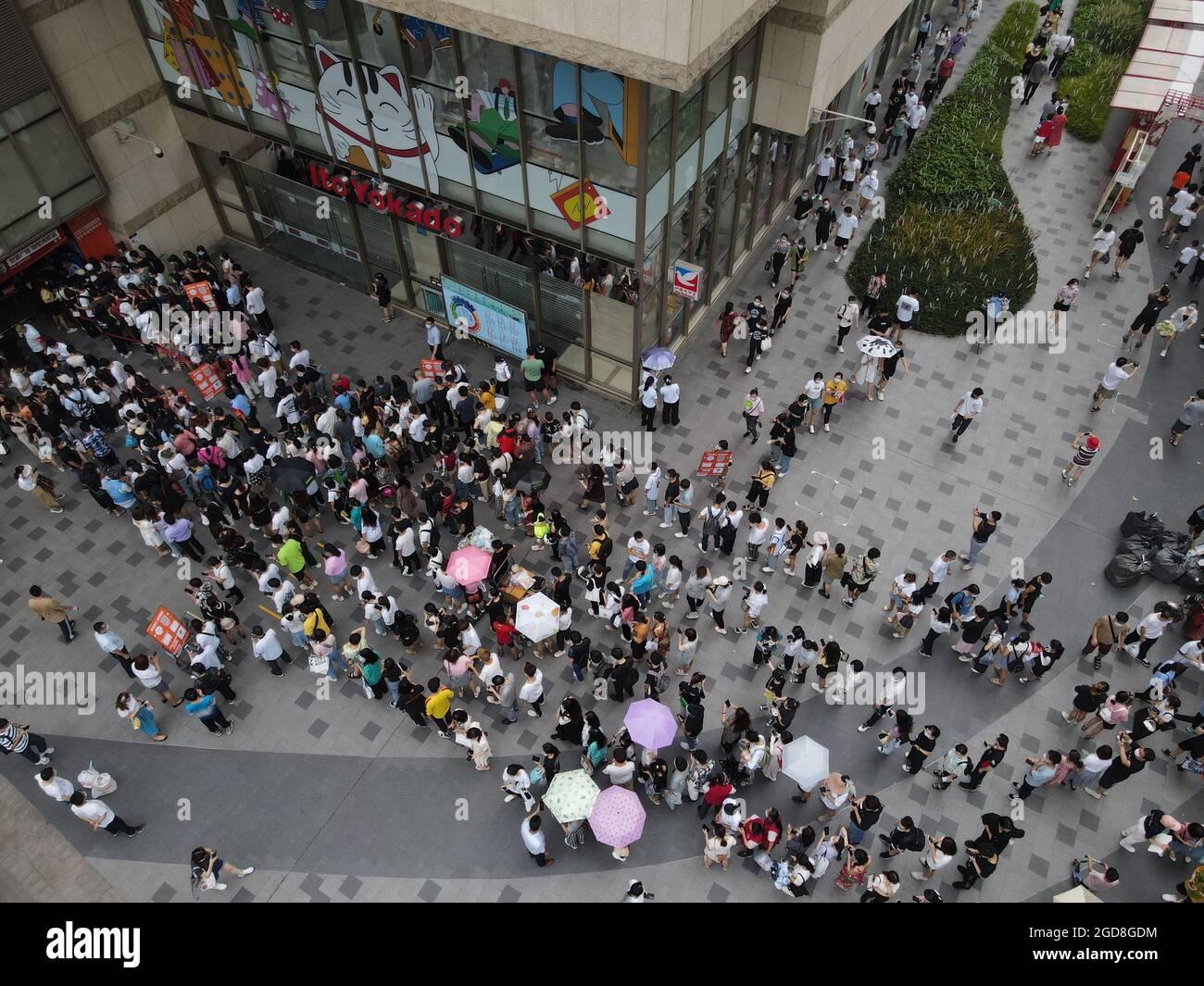 Residents from the lockdown area walk out of the street to celebrate ...