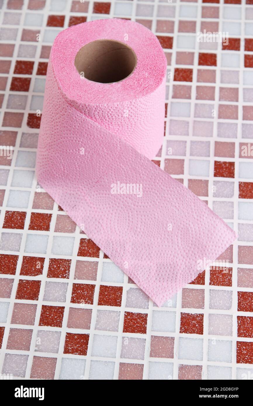 Color toilet paper rolls on bright background Stock Photo - Alamy