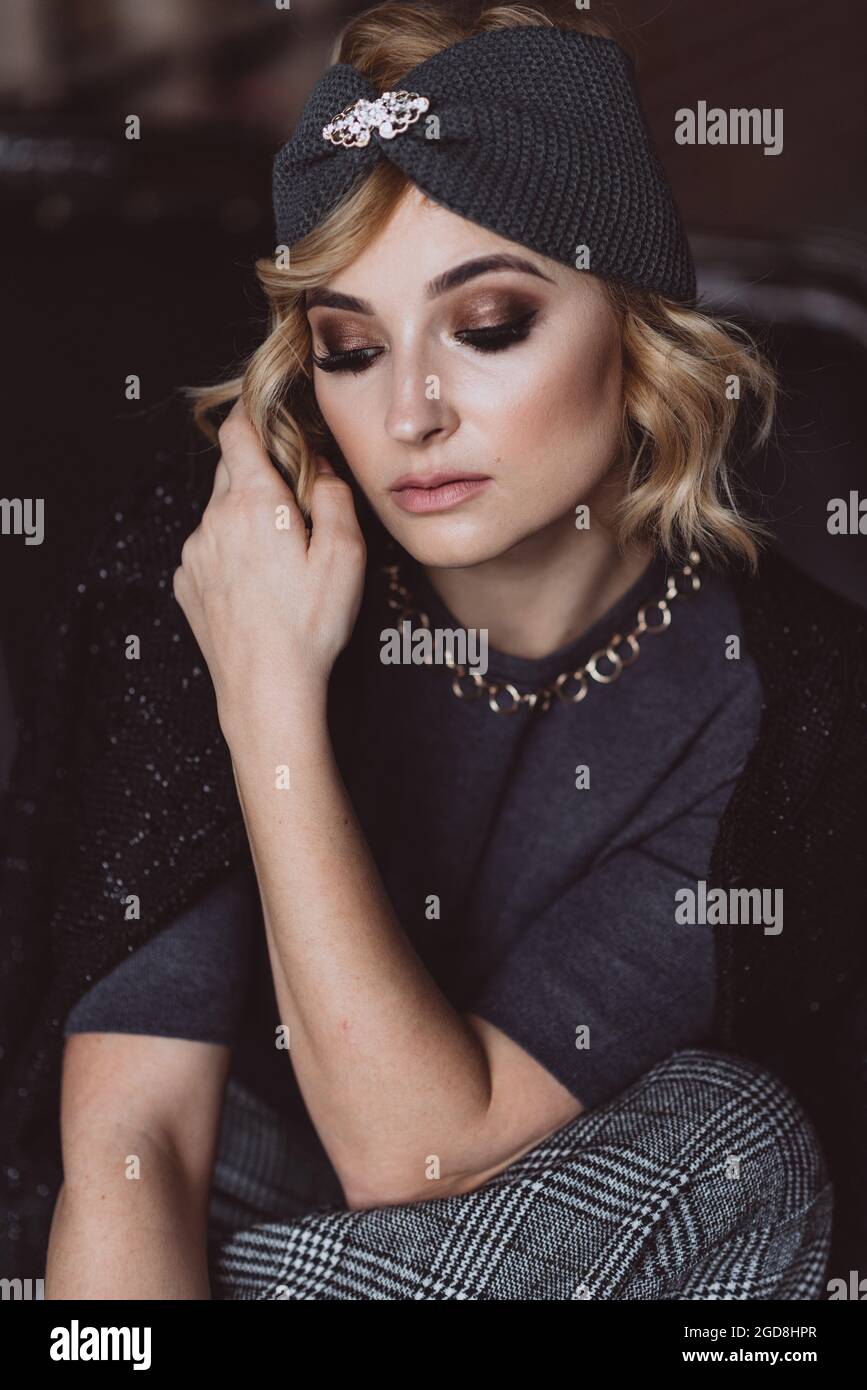Portrait Of A Beautiful Stylish Blonde Woman With Smoky Eye Makeup In A