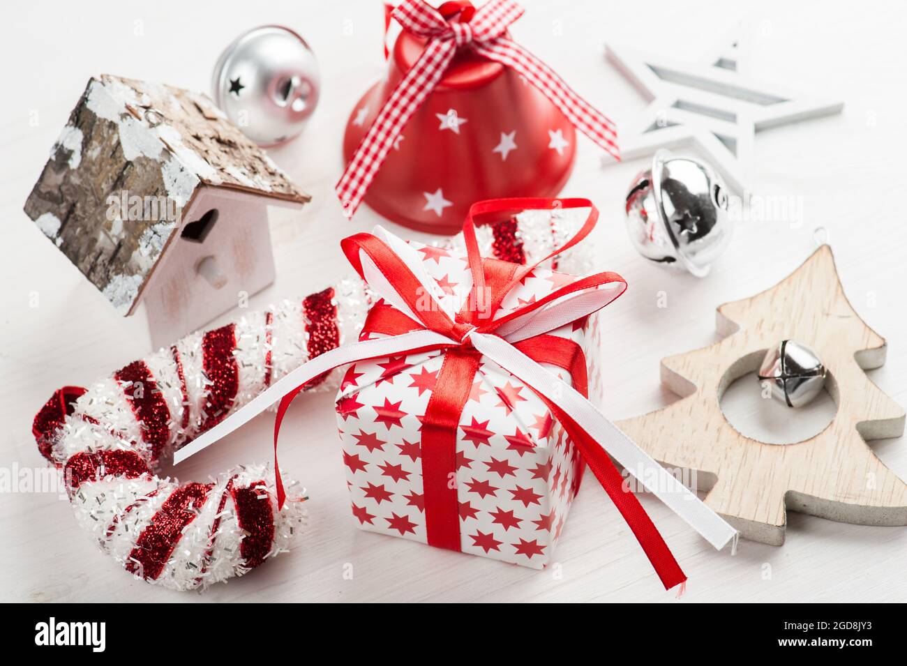 Christmas gift, bell and xmas stick. Modern lifestyle composition in ...