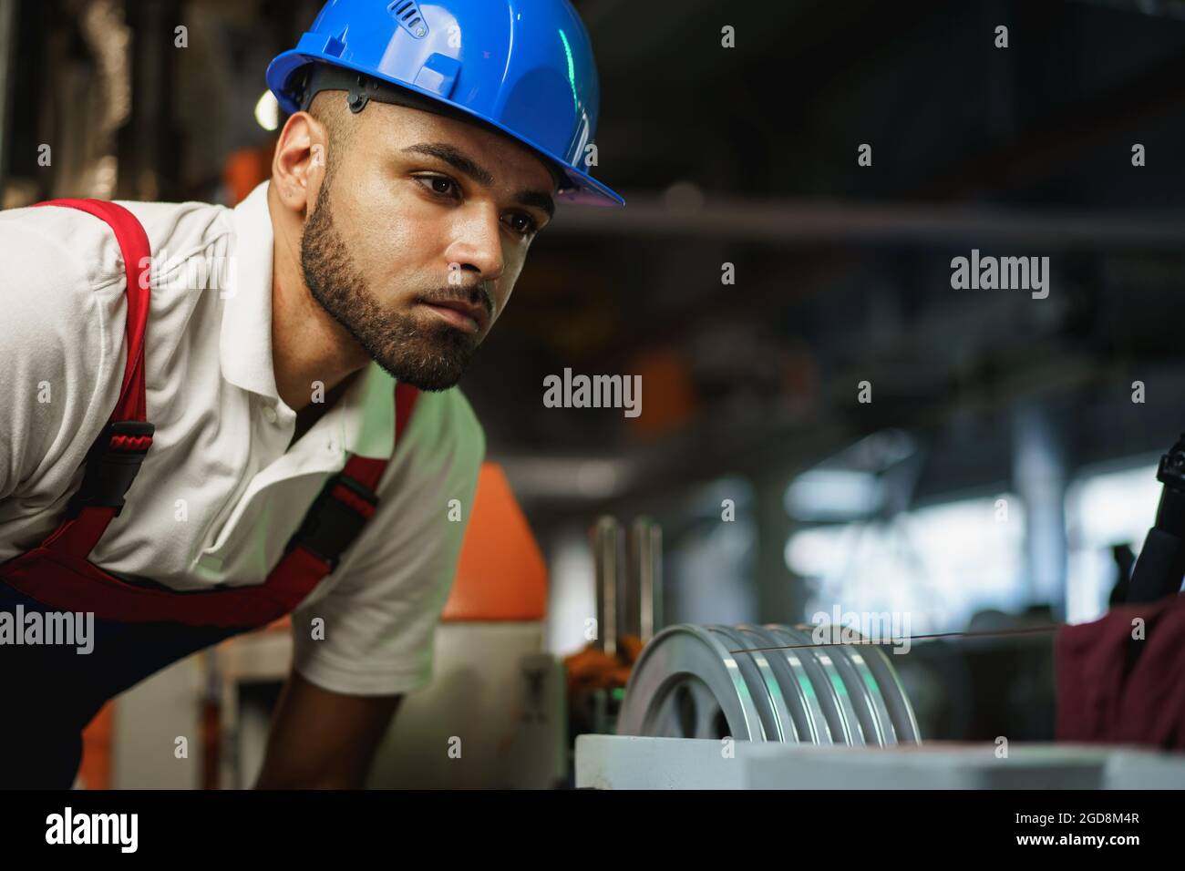 Portrait of african american male handyman working in an industrial ...