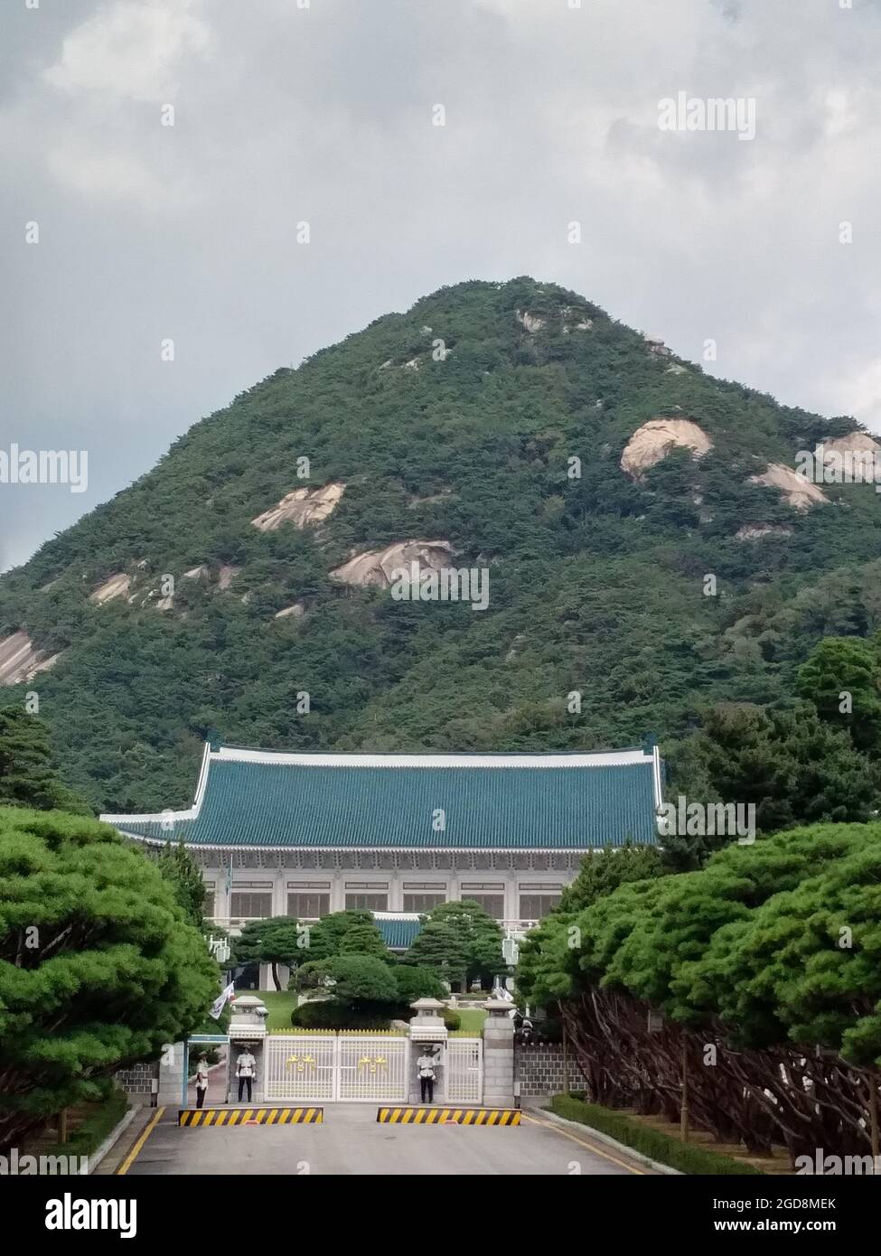 Beautiful architectural design of the Blue House below the mountain in ...