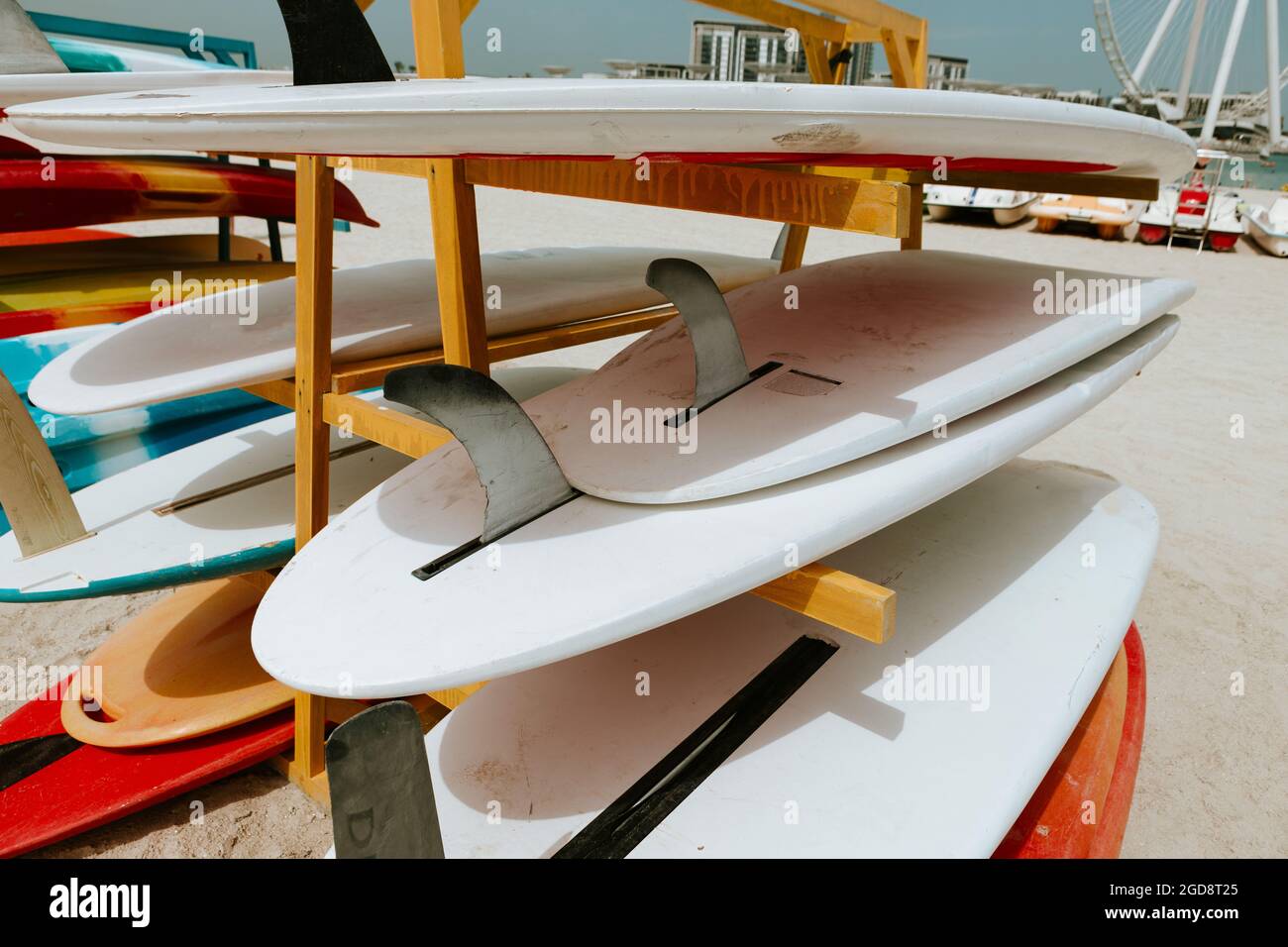 Surfboards stacked on the rack on a beach Stock Photo - Alamy