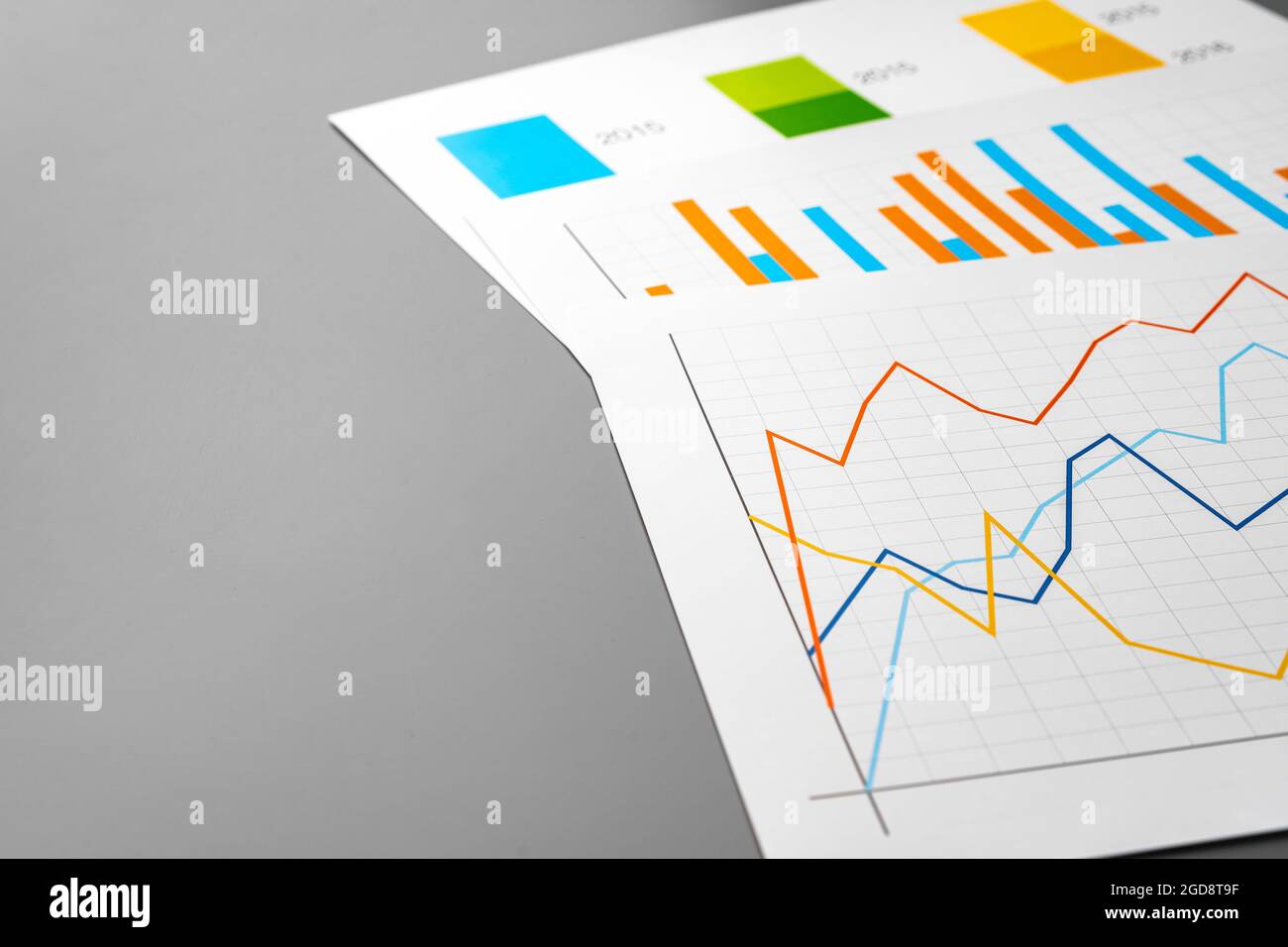Business graph analysis documents on gray background Stock Photo - Alamy