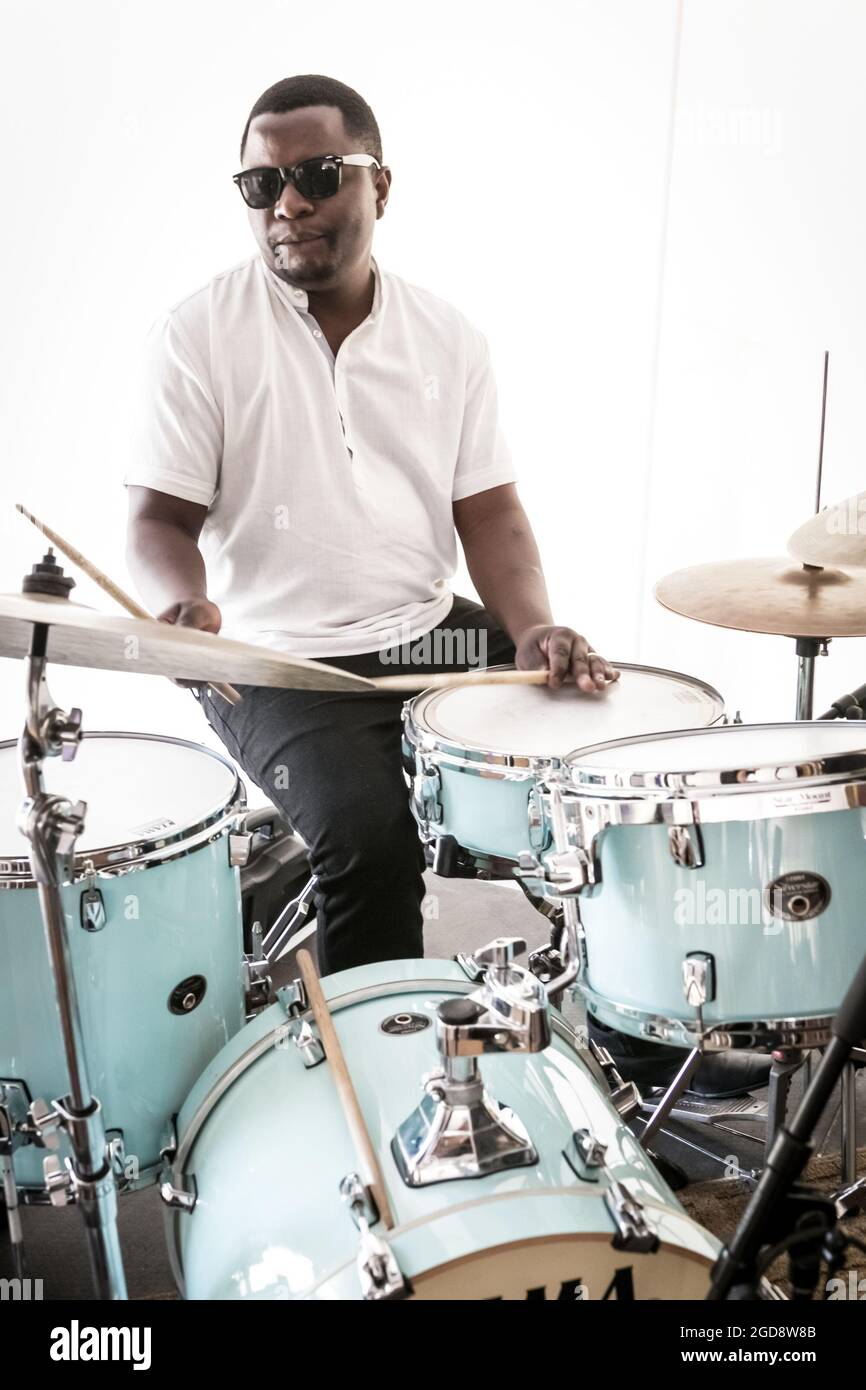 African man playing drums hi-res stock photography and images - Alamy