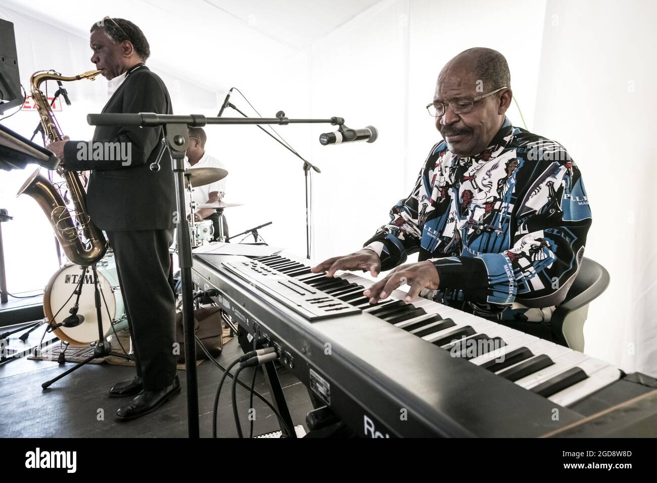 Playing different musical instruments hi-res stock photography and ...