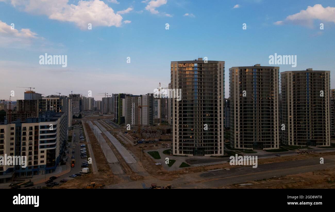 City block. Multi-storey buildings. City landscape at sunrise. Aerial ...
