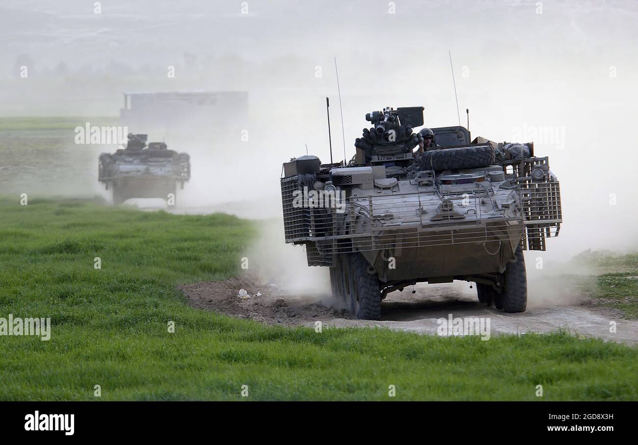 A pair of US Army (USA) M1126 Stryker Infantry Carrier Vehicles (ICV ...