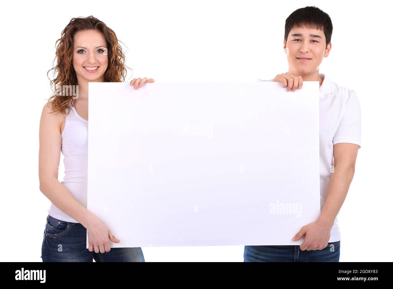 Two beautiful young people holding blank poster isolated on white Stock ...