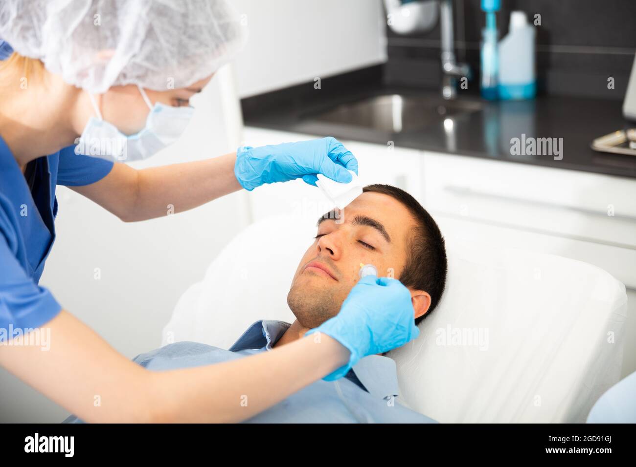 Male client getting carbon dioxide injections for face skin Stock Photo ...