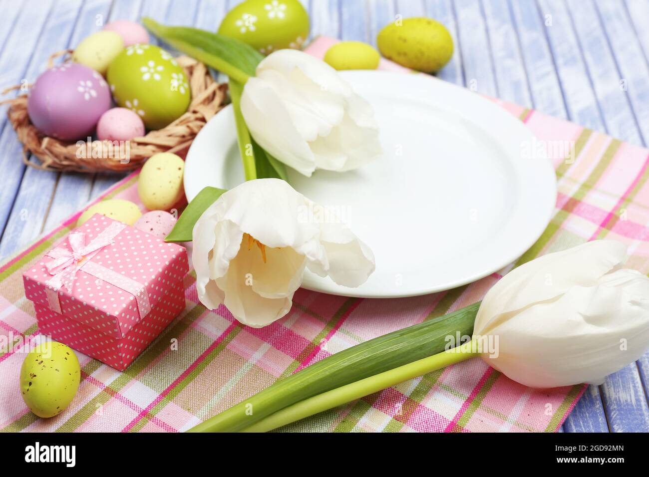 Easter table setting with tulips and eggs Stock Photo - Alamy