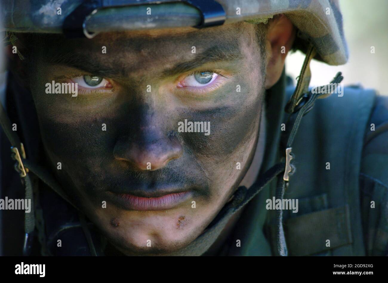 US Army (USA) Private First Class (PFC) Justin Drake maintains a ...