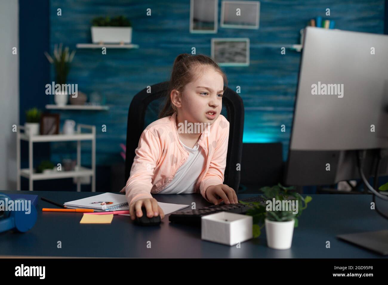 Tired elementary student joining online lesson from home feeling sad ...