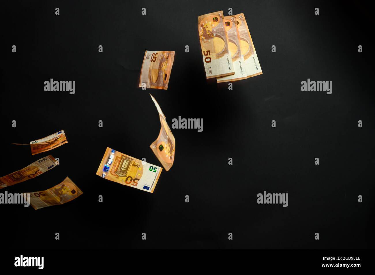 European banknotes on a black background, rain of money, human ...