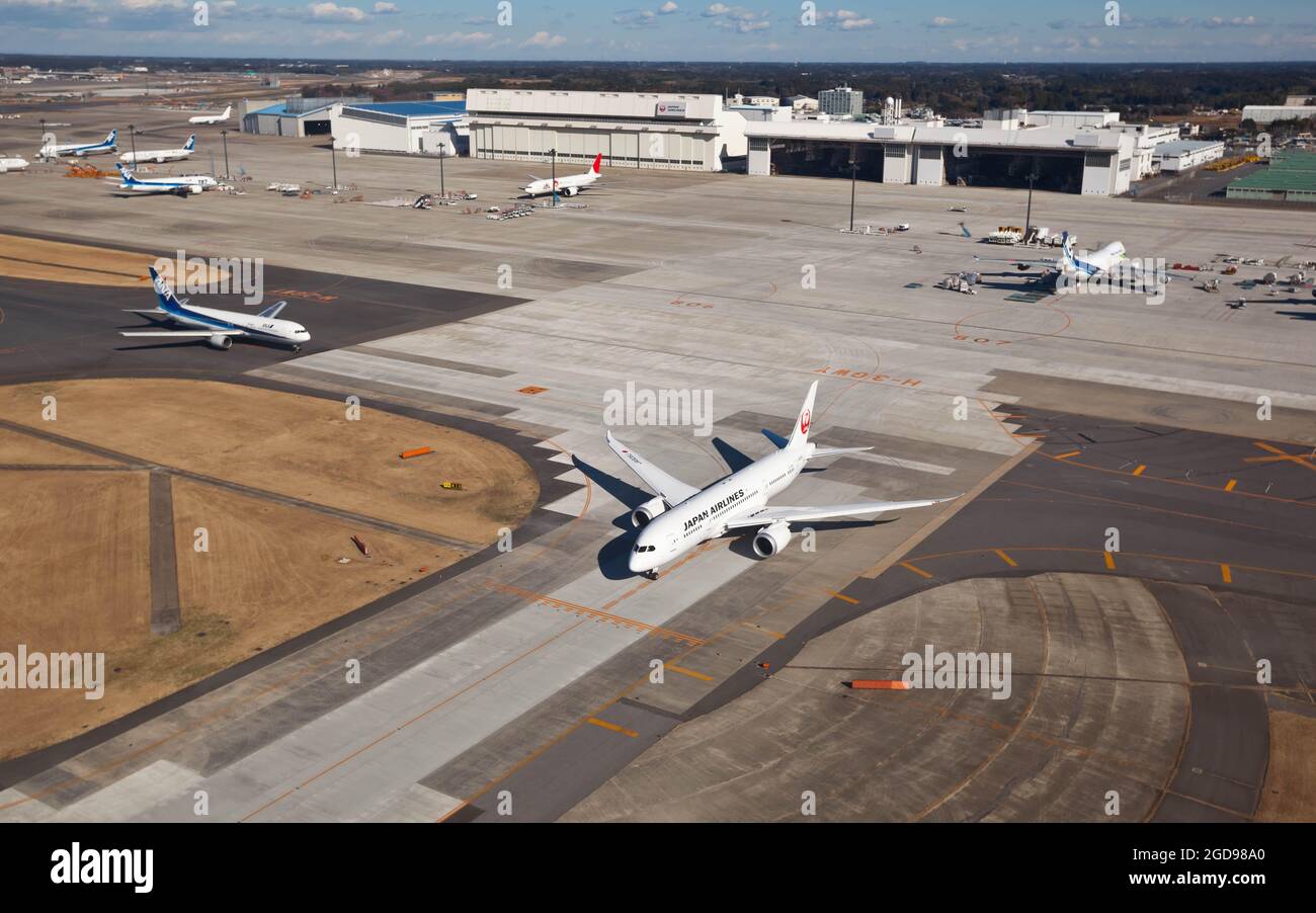 Airplanes queueing for take-off at Tokyo Narita Airport in Japan Stock ...