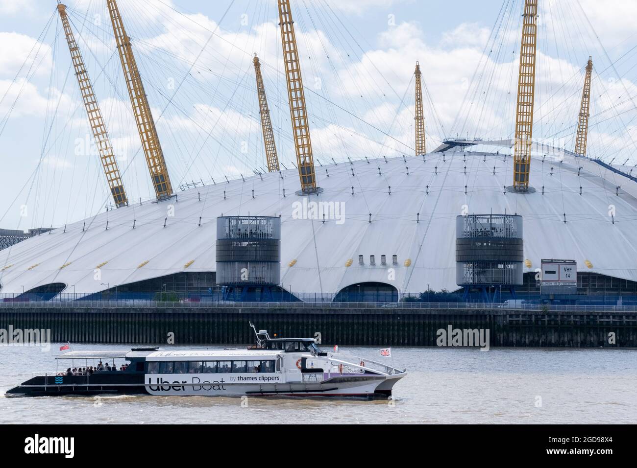 An Uber Boat on the river Thames passes the O2 Arena (formerly the ...