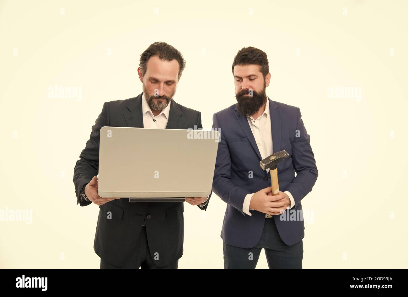 Men with laptop and hammer. Breakdown and malfunction. Lags annoy them ...