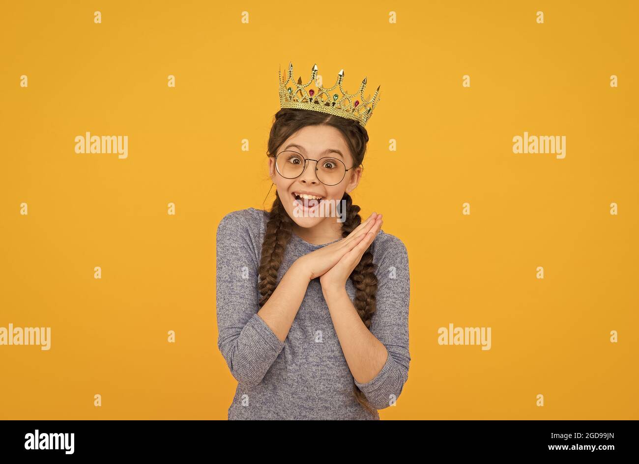 Long awaited reward. Little smart girl wear eyeglasses. Clever child ...