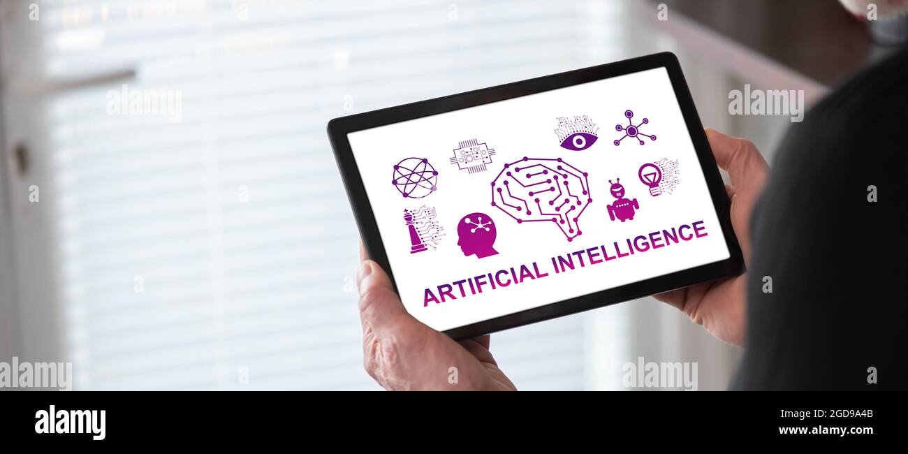 Artificial intelligence concept shown on a tablet held by a man Stock ...