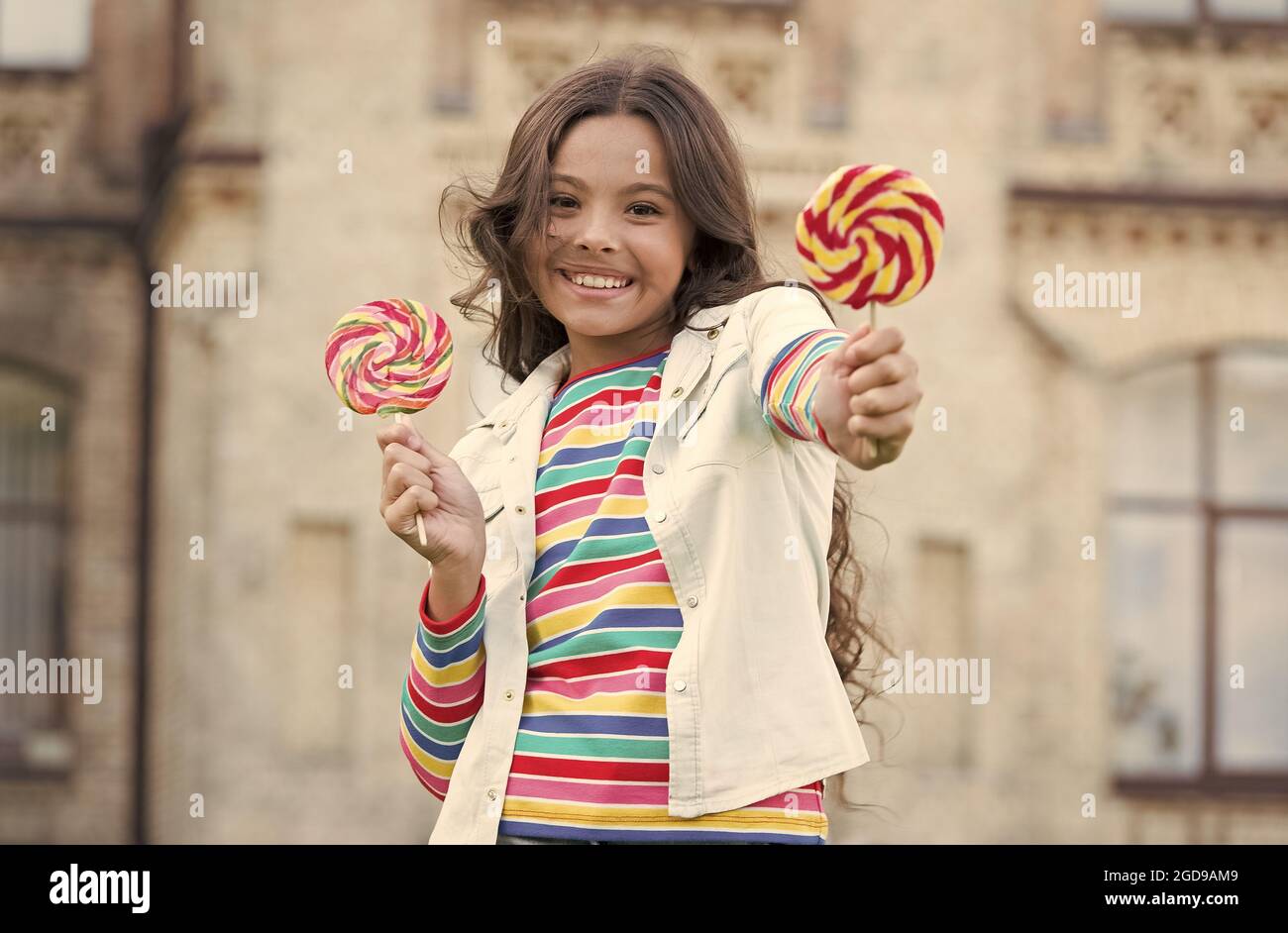 happy childrens day. small girl has curly hair. spring holiday mood ...