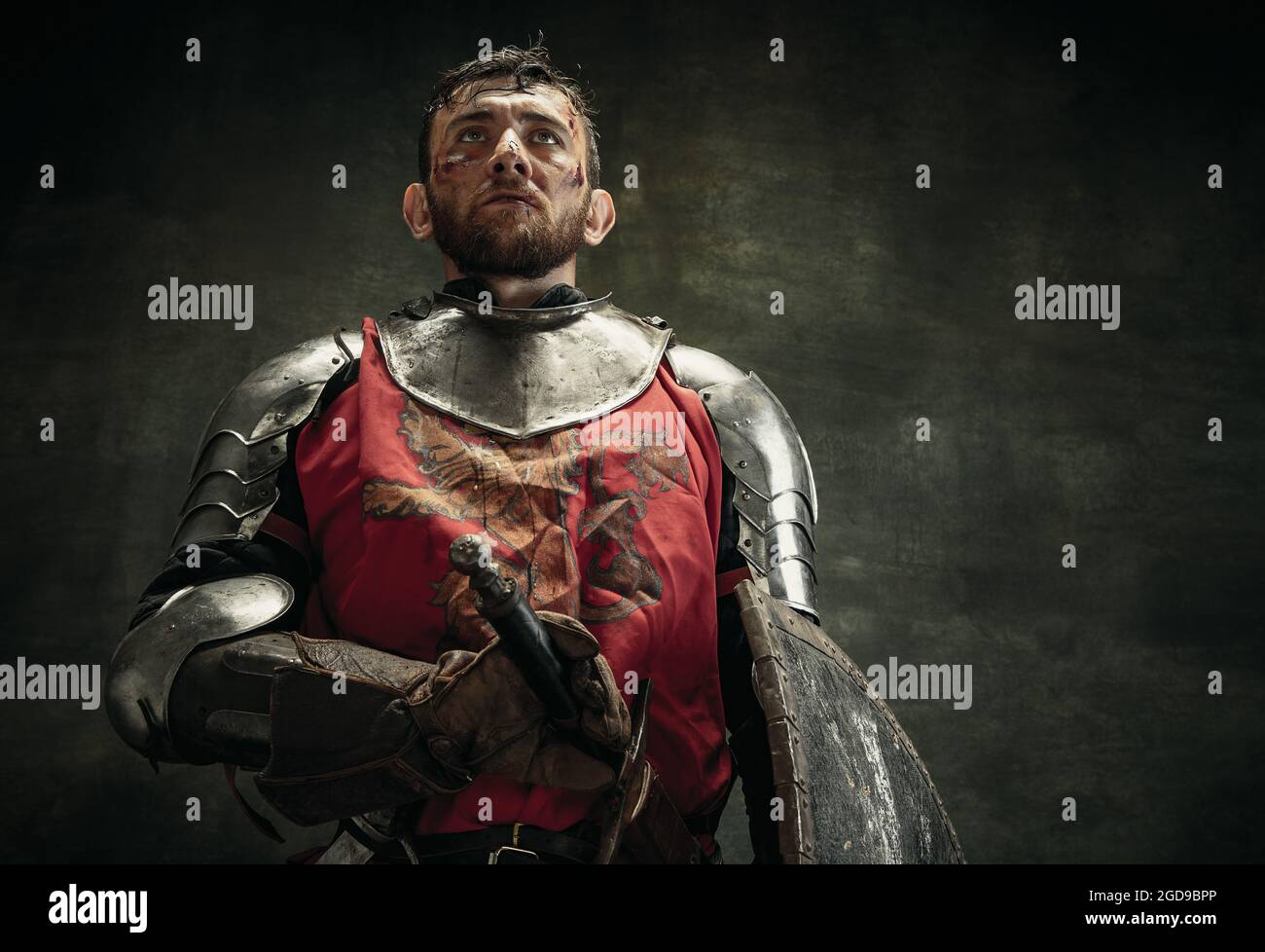 Portrait of one brutal bearded man, medeival warrior or knight with ...