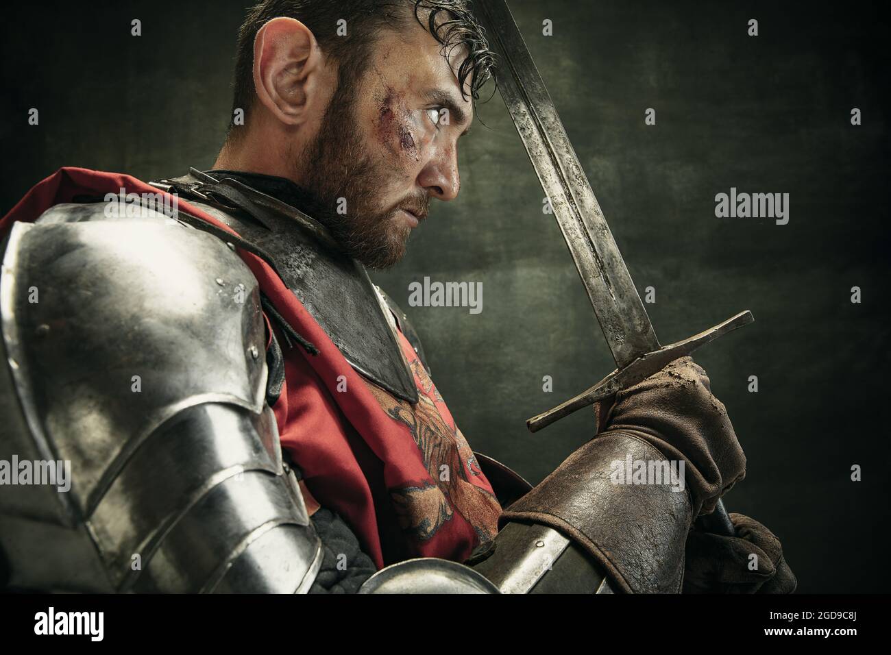 Side view. Portrait of one brutal bearded man, medeival warrior or ...