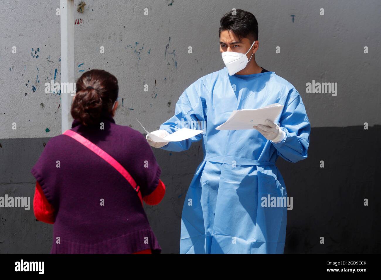 Non Exclusive: MEXICO CITY, MEXICO - AUGUST 10: A woman receives ...