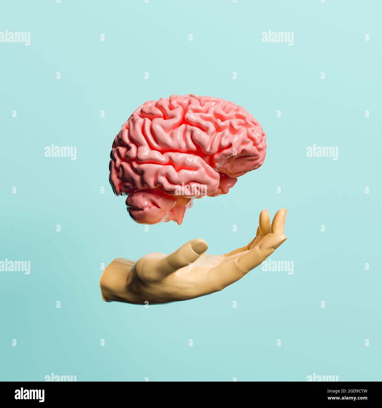 hand with a brain floating above it. concept of learning and mental ...