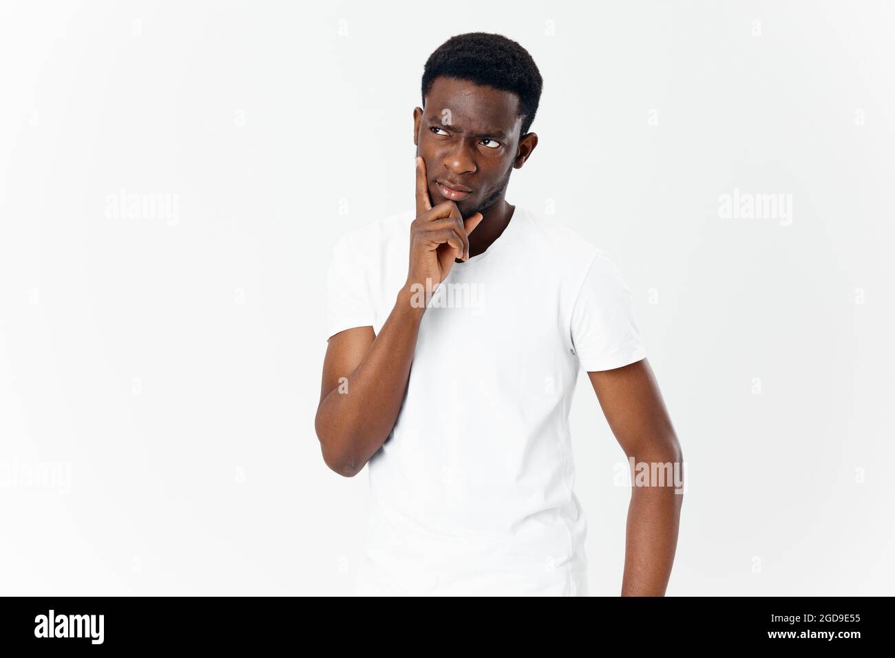 african man puzzled look light t-shirt isolated background cropped view ...