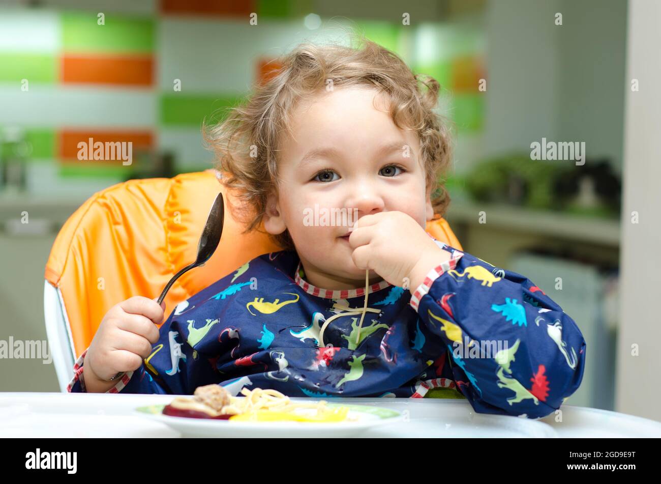 little child eating at home Stock Photo - Alamy