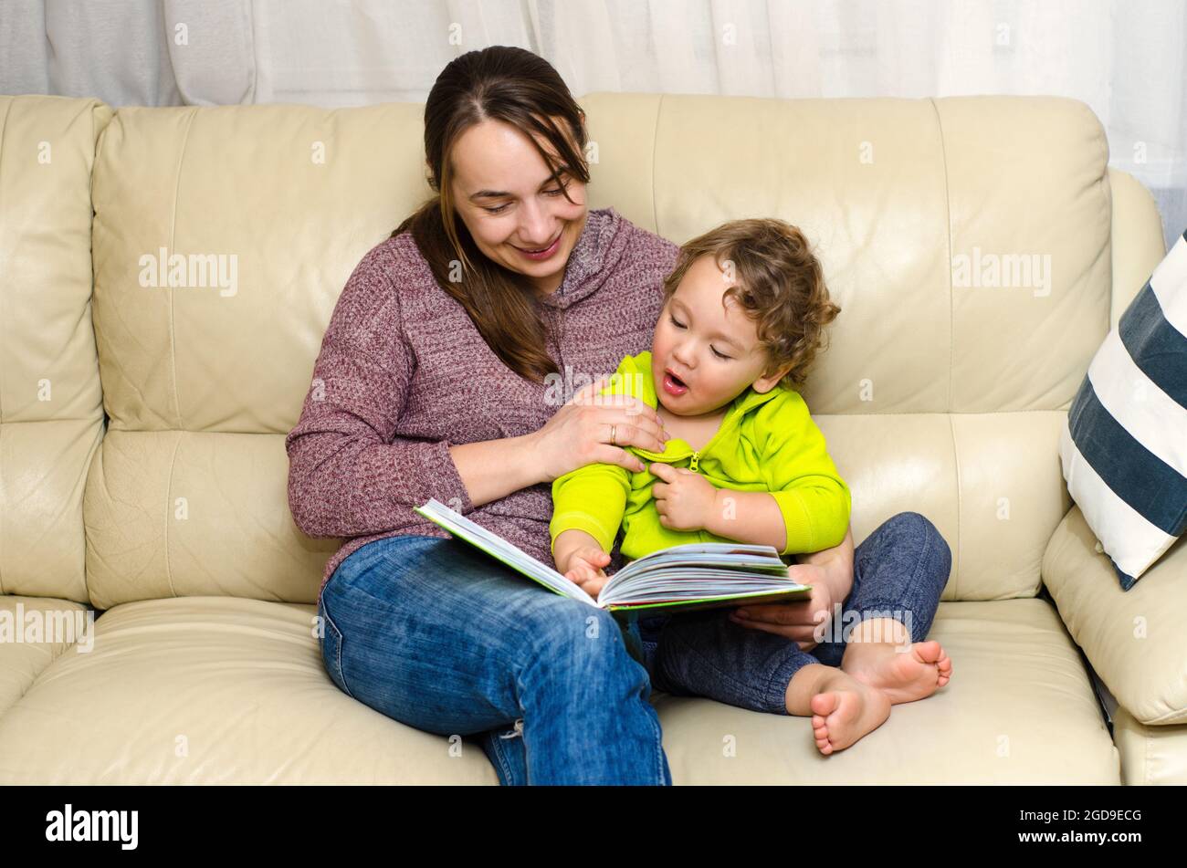 mother and child reading book at home Stock Photo - Alamy