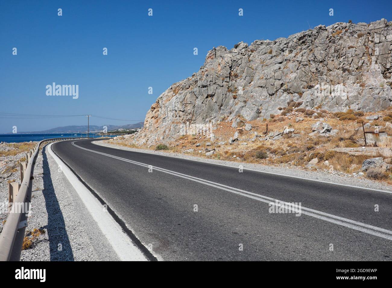 Greek Roadway with Rock and Sea in the Distance. Beautiful Driveway ...