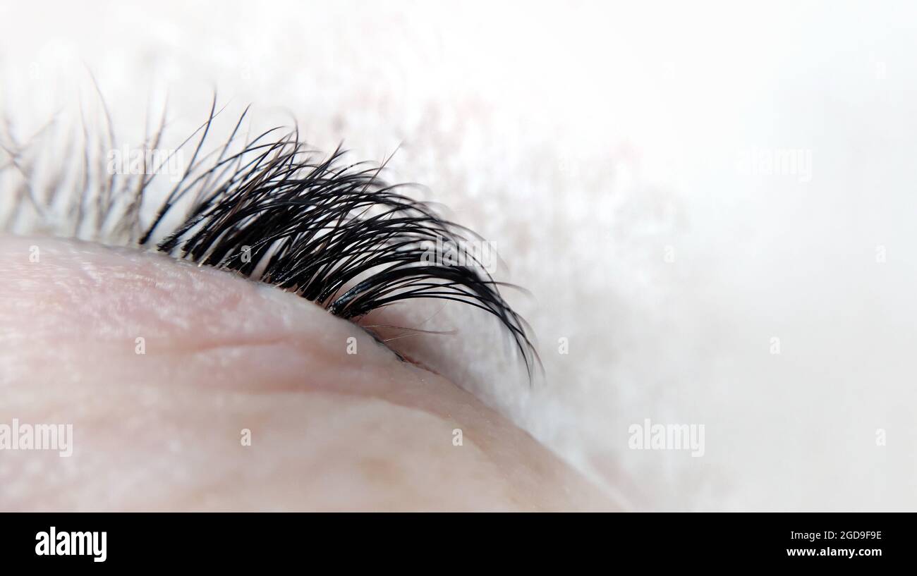 Lash extensions in beauty salon macro eye top view Stock Photo - Alamy