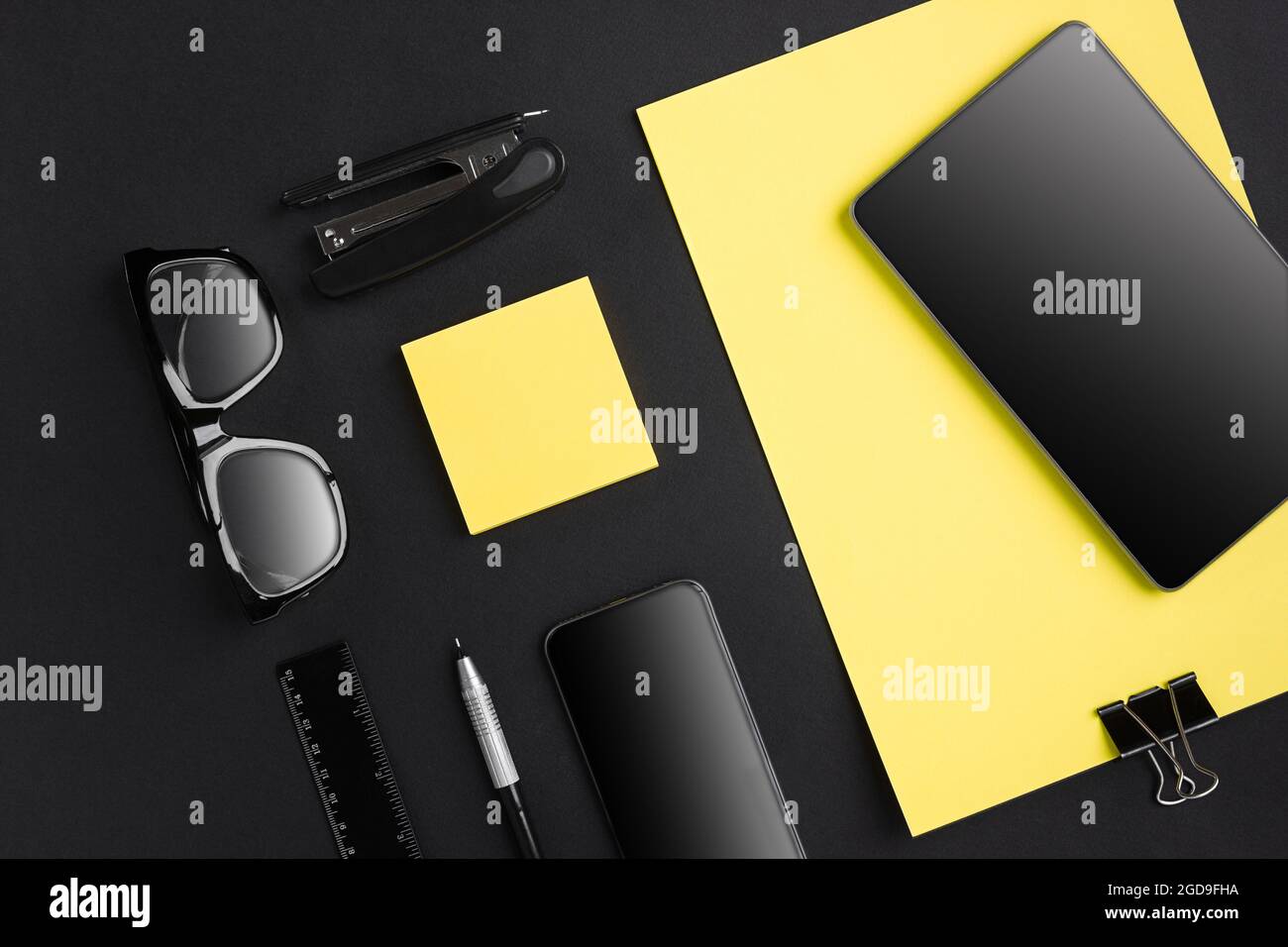 Office items on black background Stock Photo - Alamy