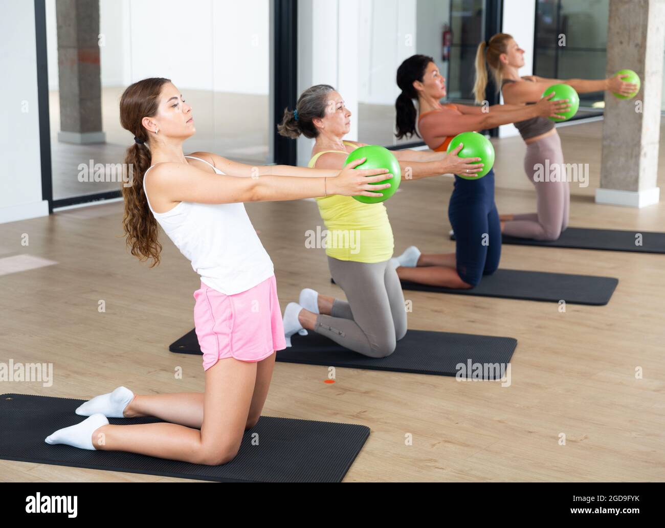 Women holding bender balls in hands Stock Photo - Alamy