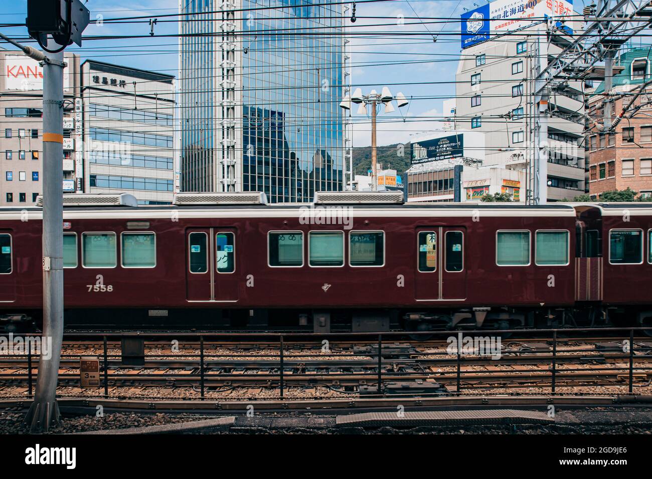 Old train on the station in the modern city of Kobe, Japan Stock Photo ...