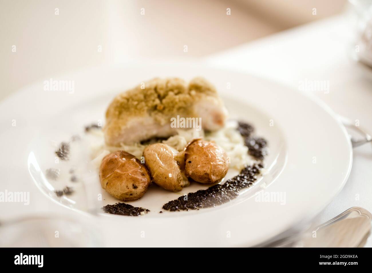 Traditional Portuguese meal made of baked cod served with baked potato ...