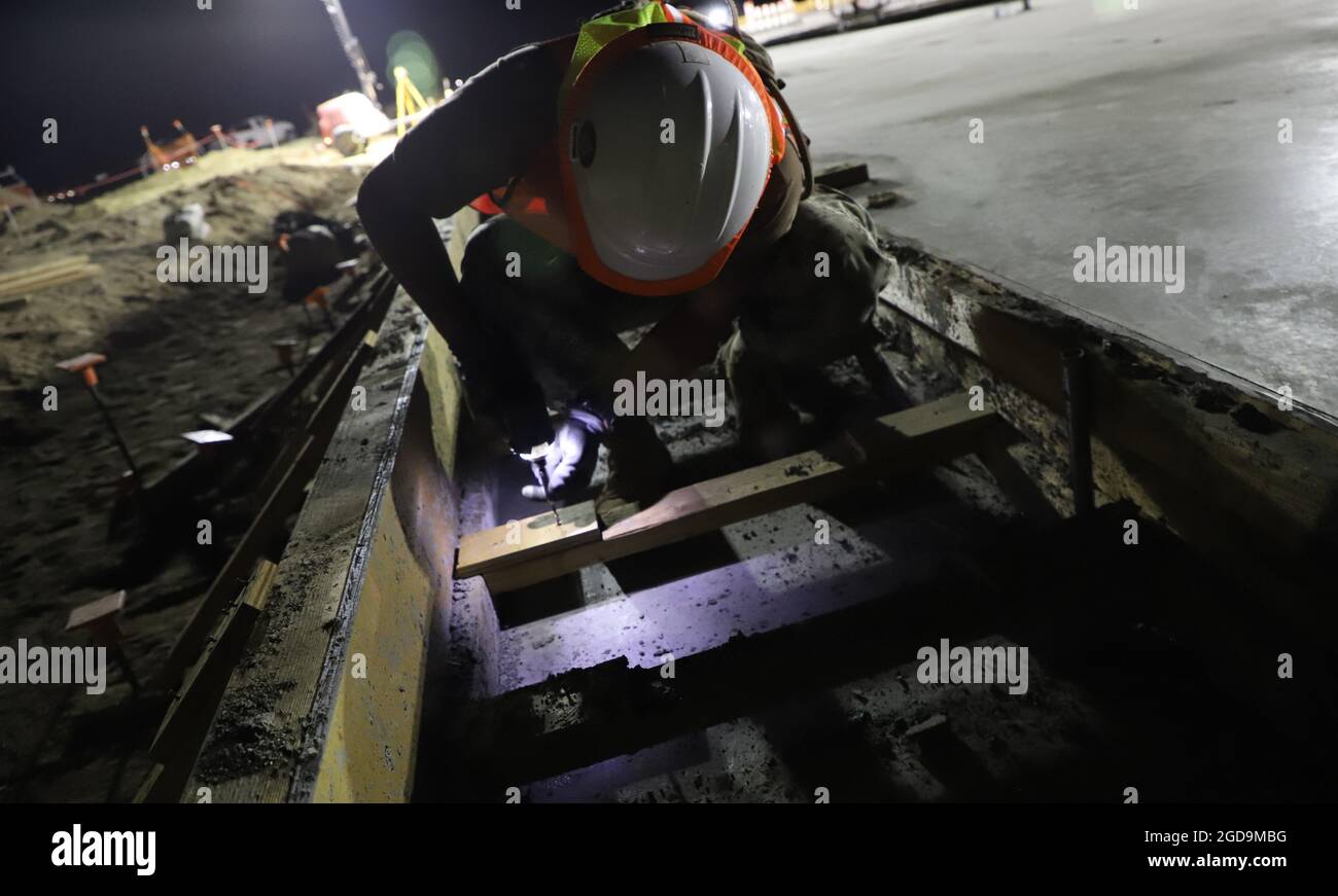 Seabee from Naval Mobile Construction Battalion FOUR (NMCB 4) breaking ...